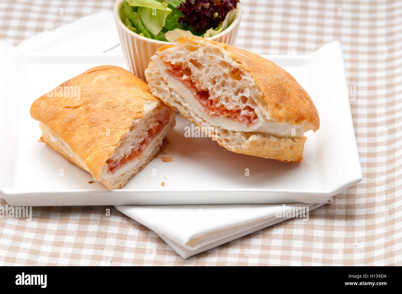 ciabatta panini sandwich with parma ham and tomato Stock Photo - Alamy