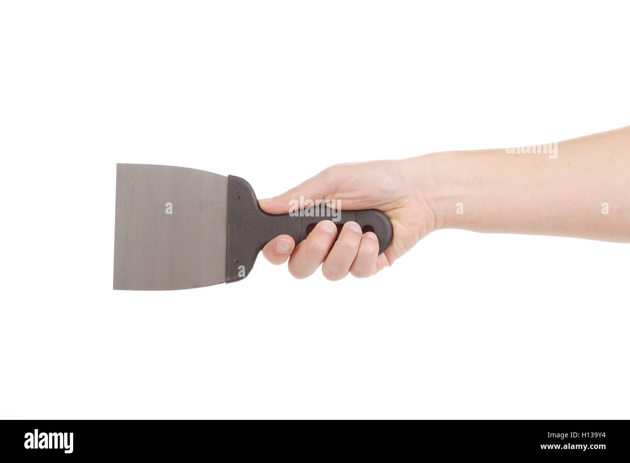 Hand holds construction spatula Stock Photo - Alamy