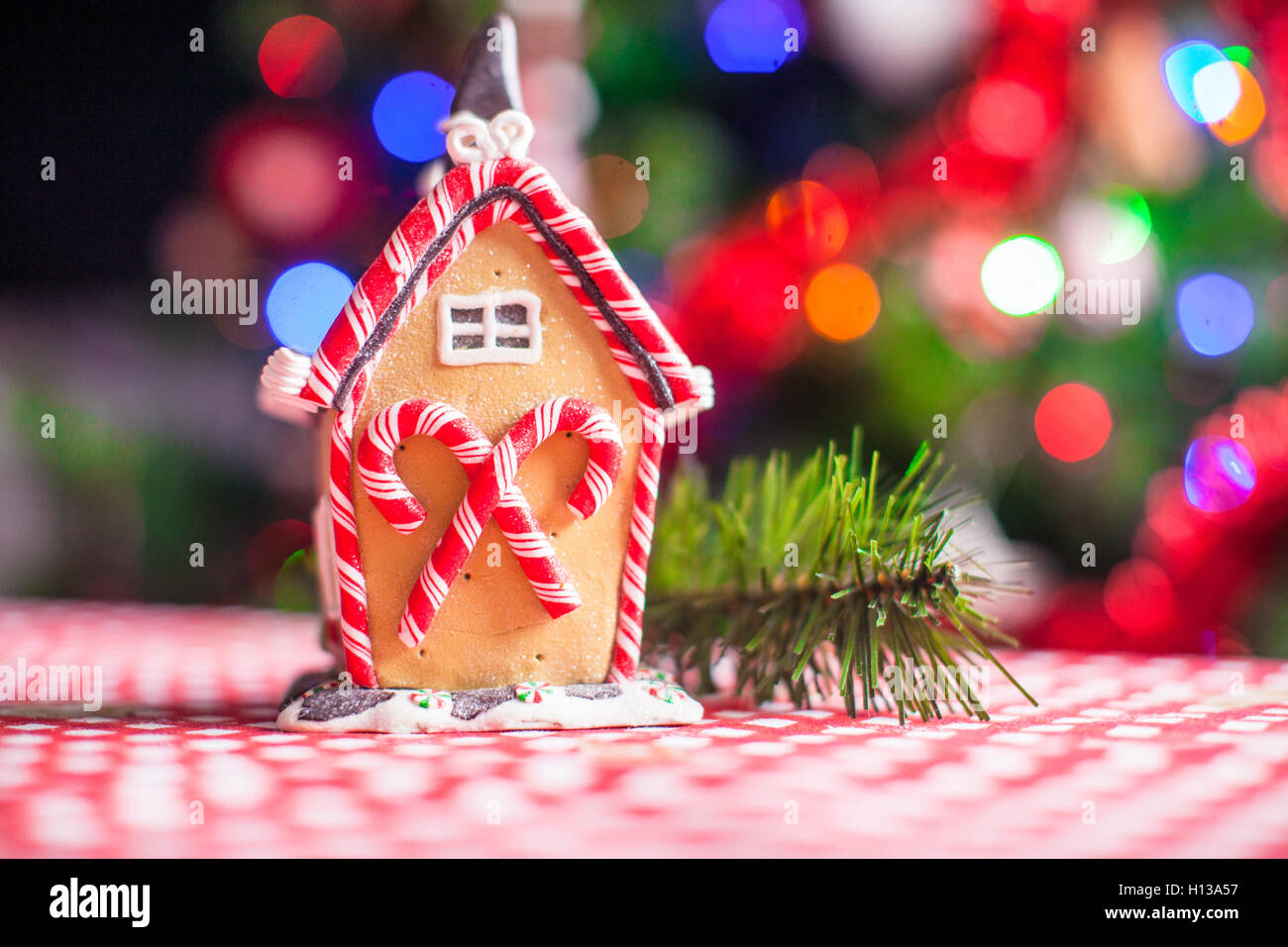 Close-up Gingerbread fairy house decorated by colorful candies on a ...