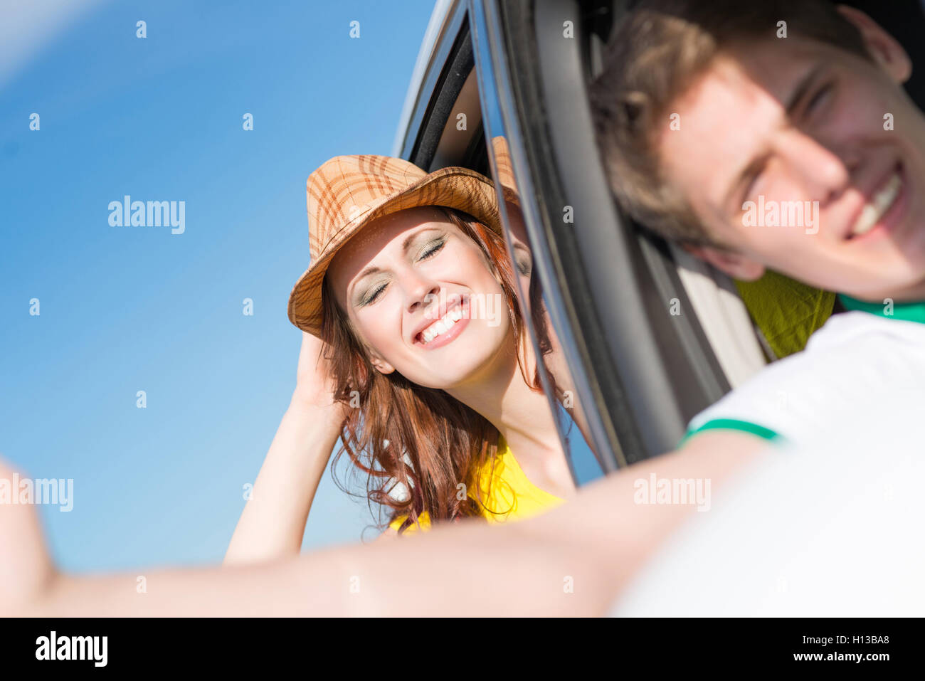 Young woman looking out of car window Stock Photo - Alamy