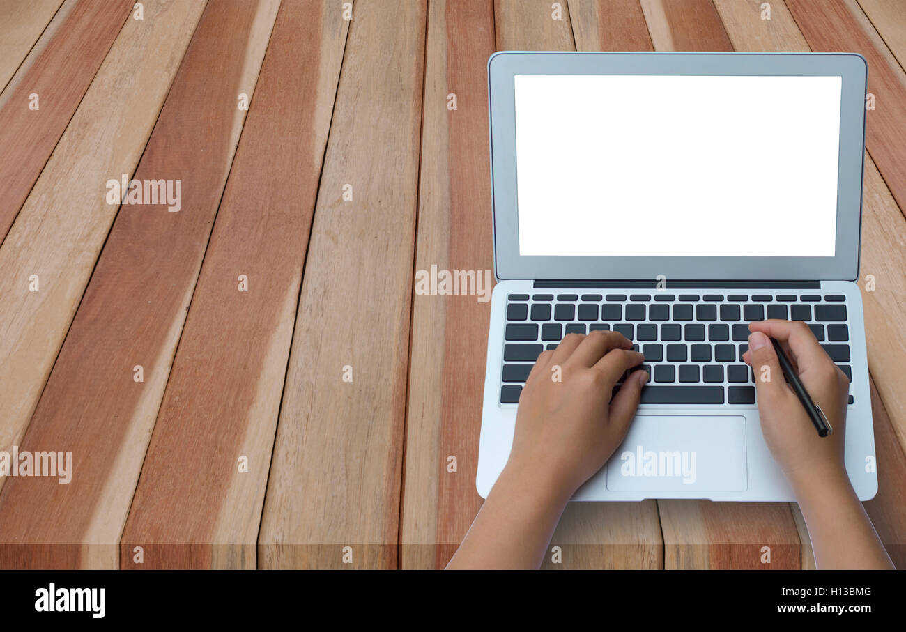 laptop empty on wooden background.Hands working with computer in office ...