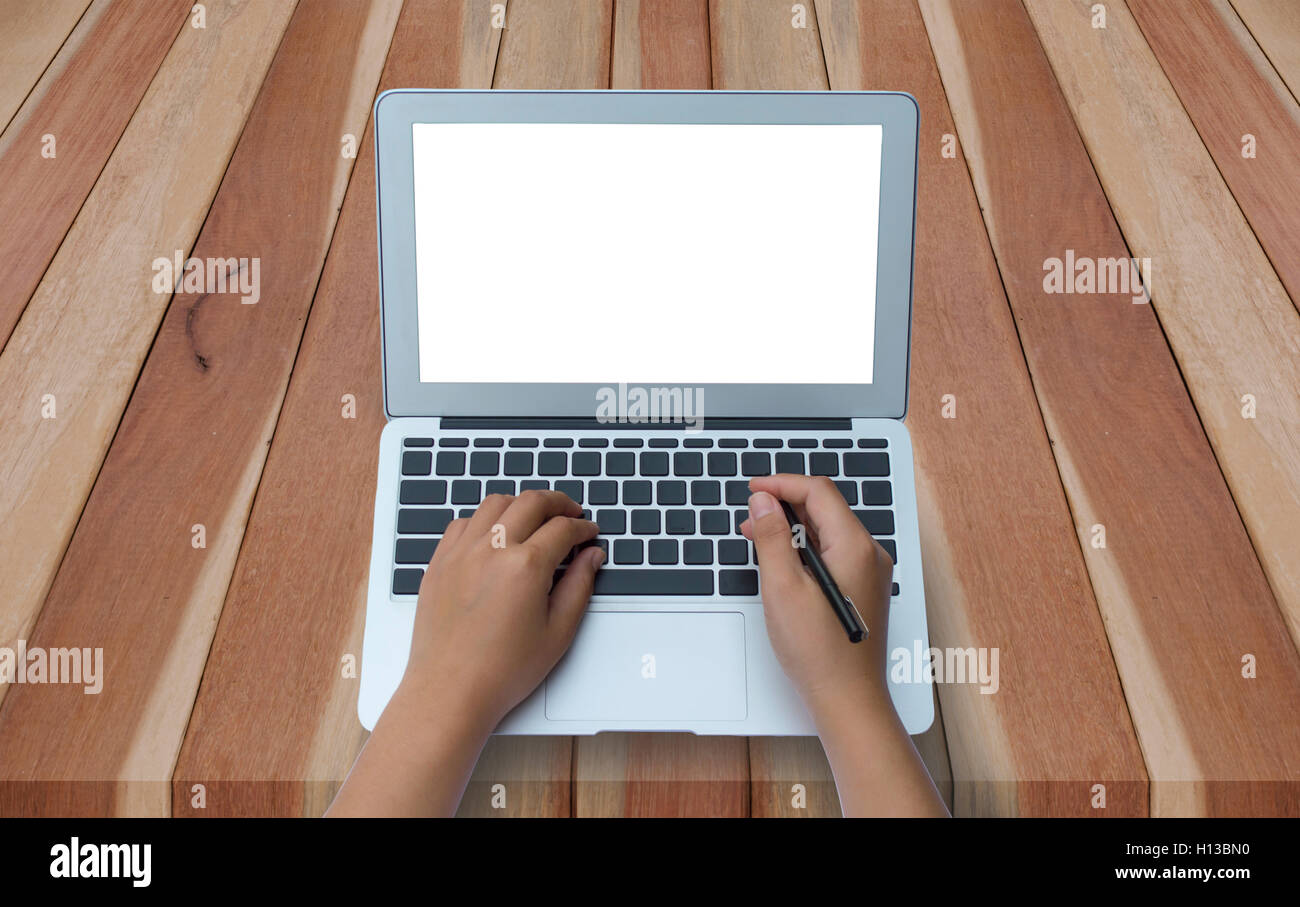 laptop empty on wooden background.Hands working with computer in office ...