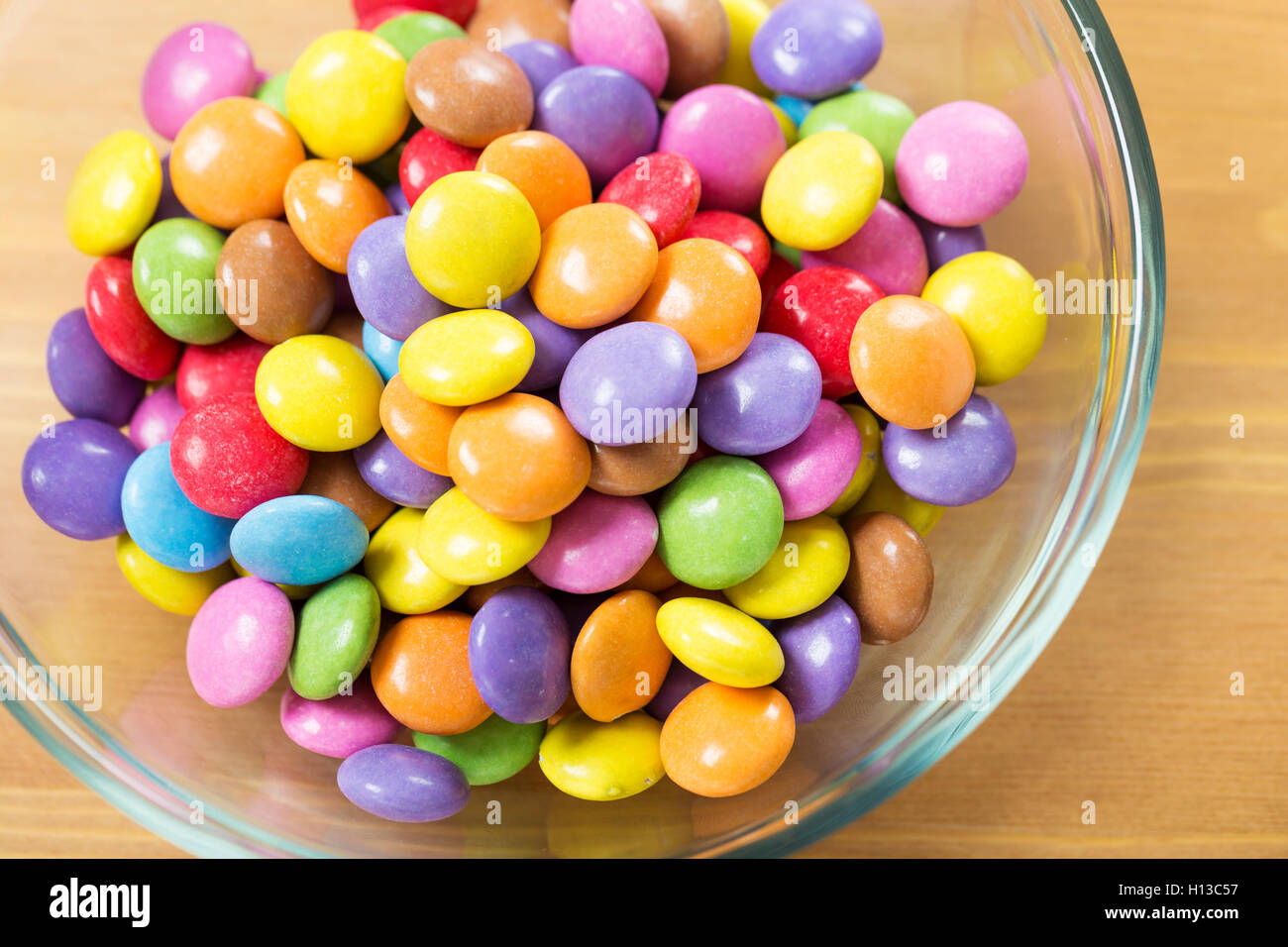 Colorful candy in bowl Stock Photo - Alamy