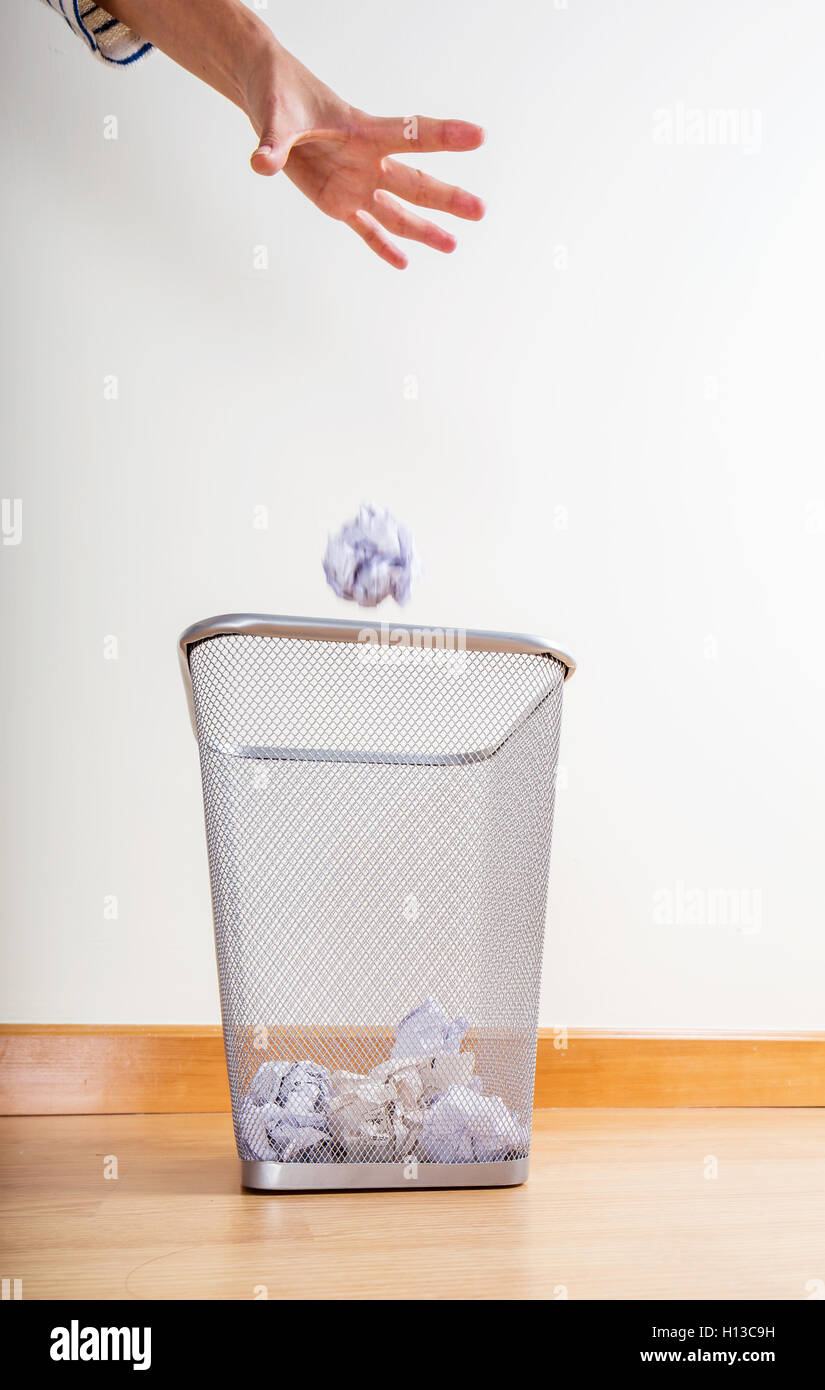 Throwing of paper ball by hand Stock Photo - Alamy