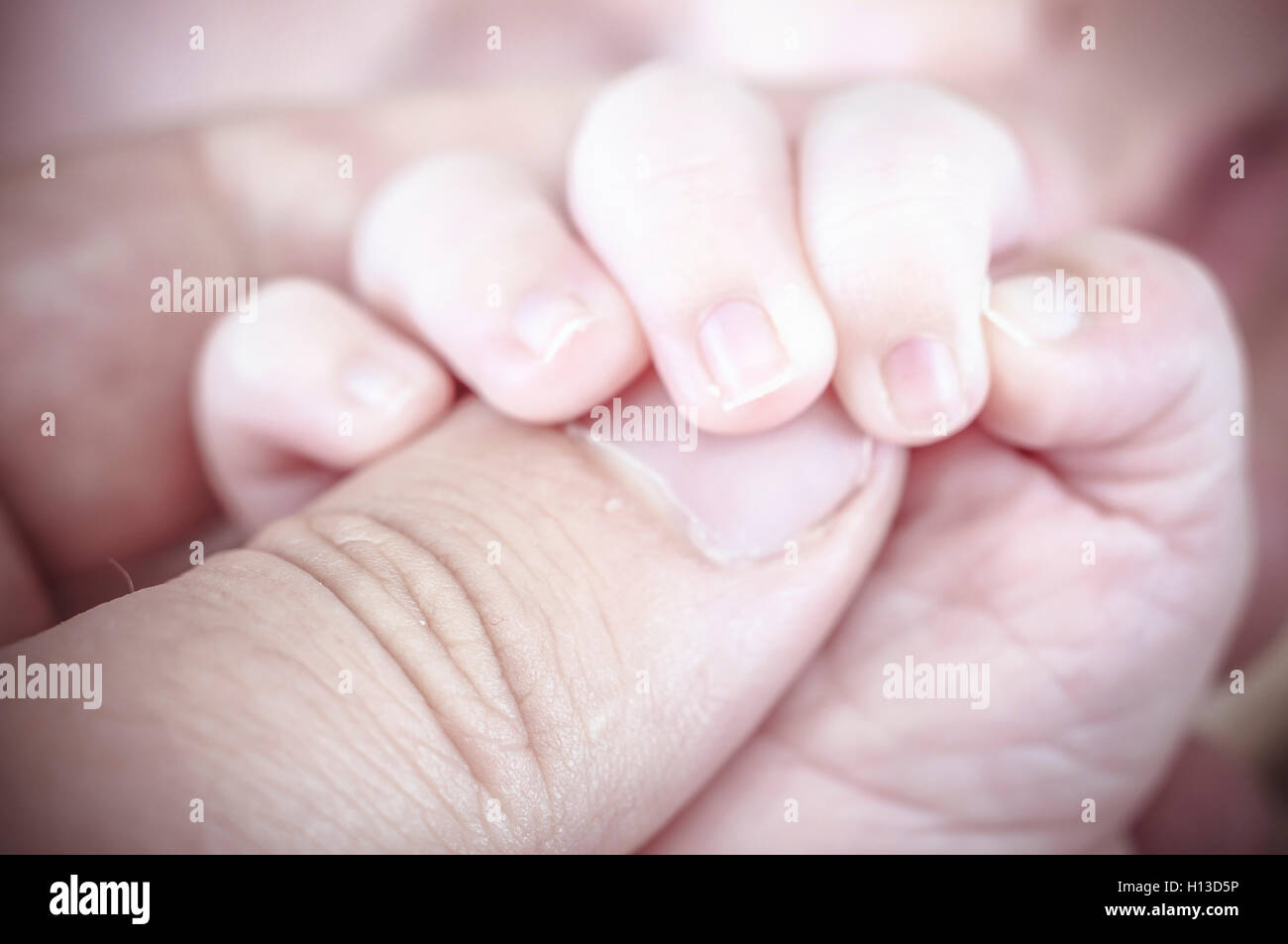 new born baby curled up sleeping on a blanket, multiple expressi Stock ...