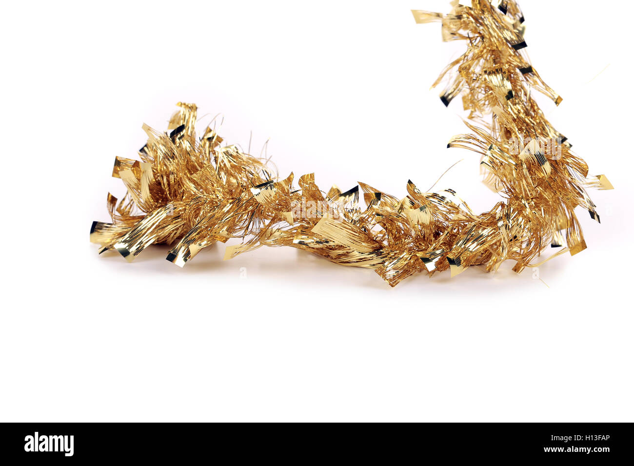 Christmas golden tinsel Stock Photo - Alamy