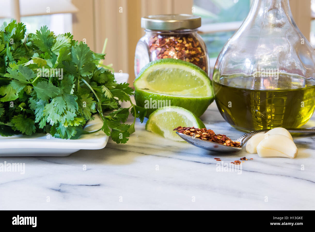 Mexican food ingredients in a kitchen on a marble top . Cilantro red ...