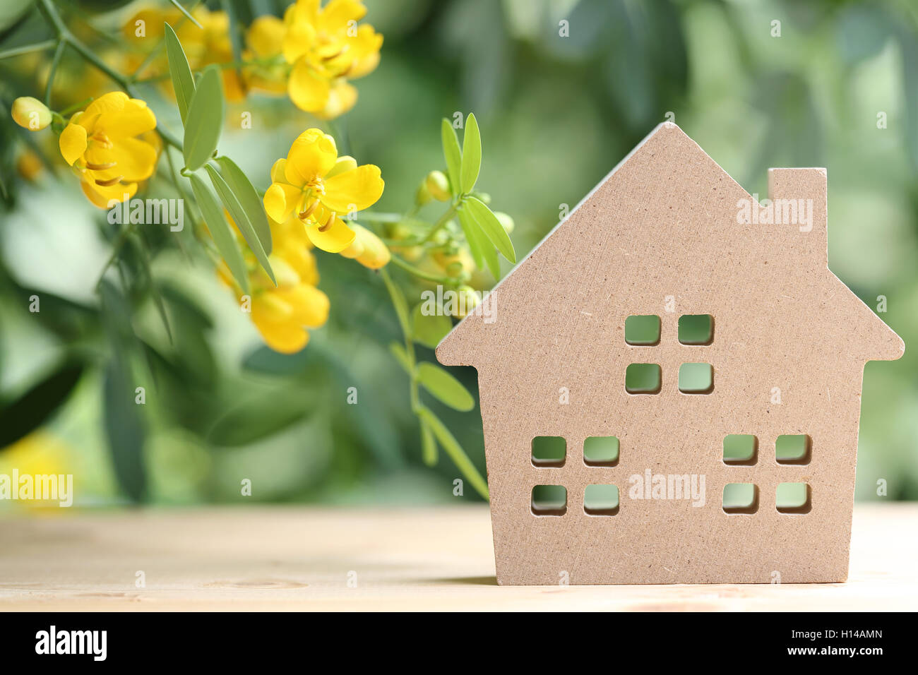 wooden toy house with beautiful blossom tree Stock Photo - Alamy