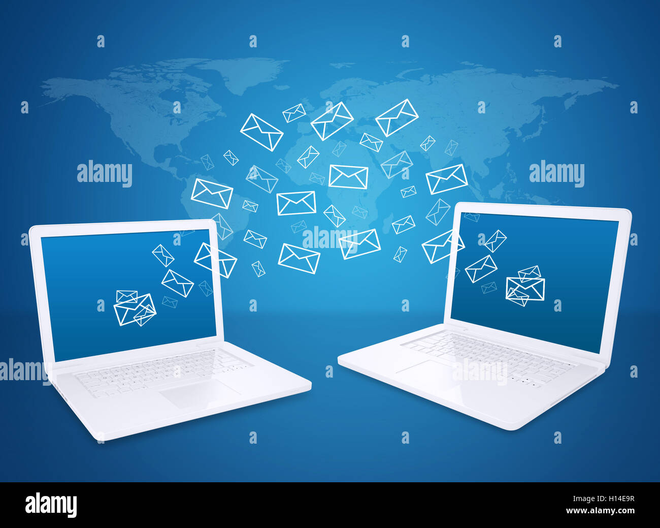Two laptops exchange letters Stock Photo - Alamy