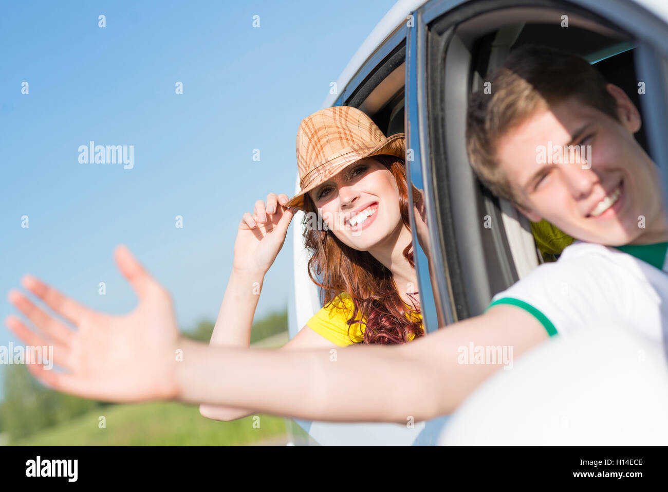 Young woman looking out of car window Stock Photo - Alamy