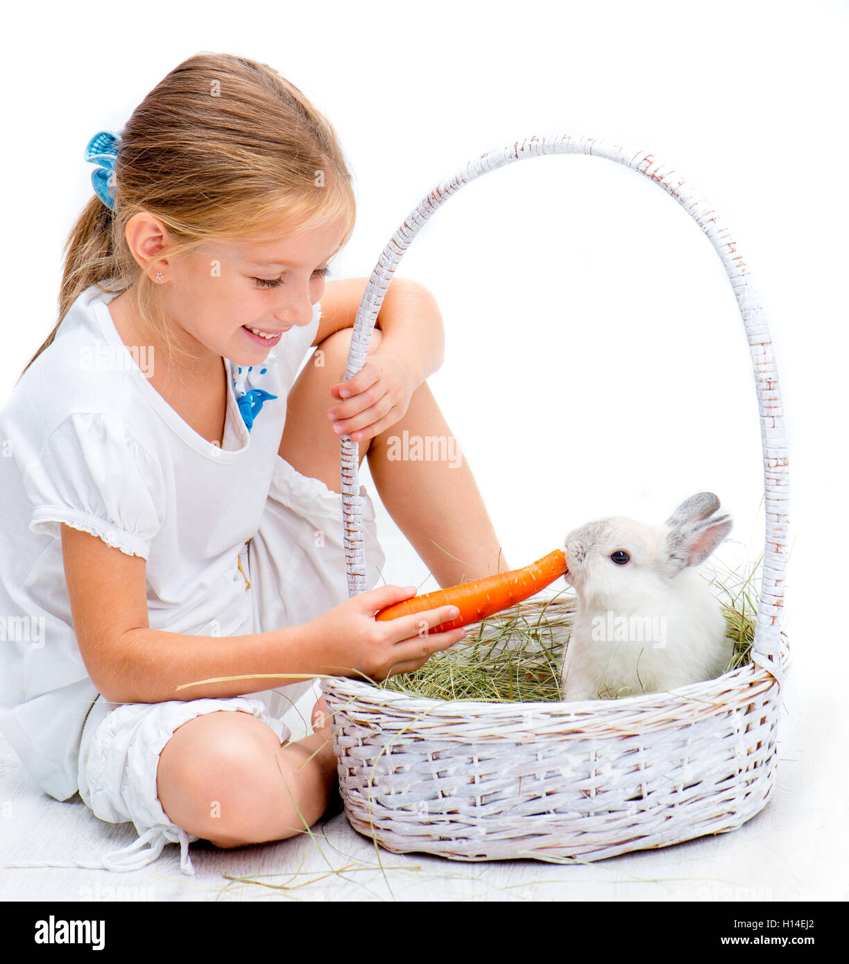 Little girl with a rabbit Stock Photo - Alamy