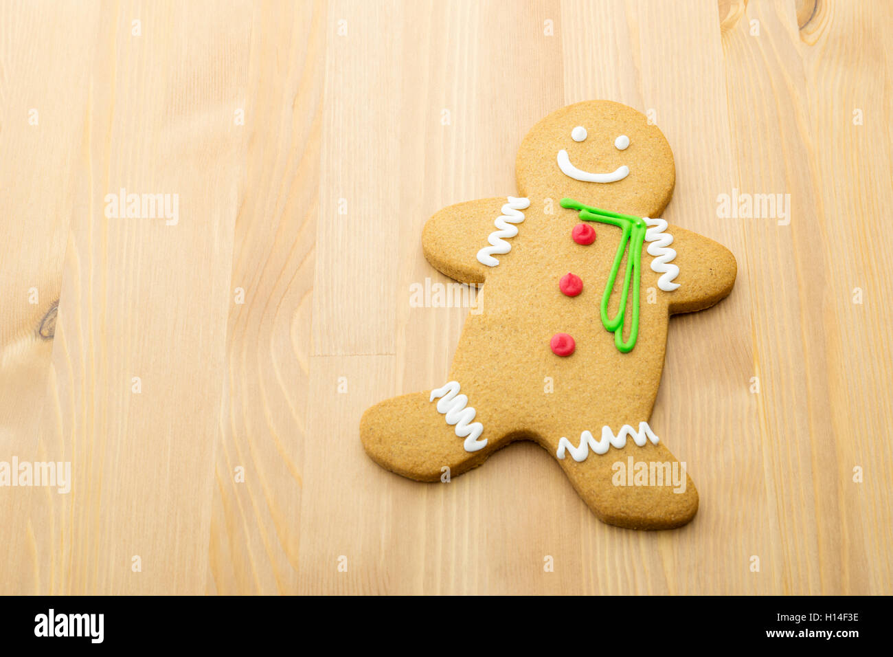 Gingerbread man over the wooden background Stock Photo - Alamy