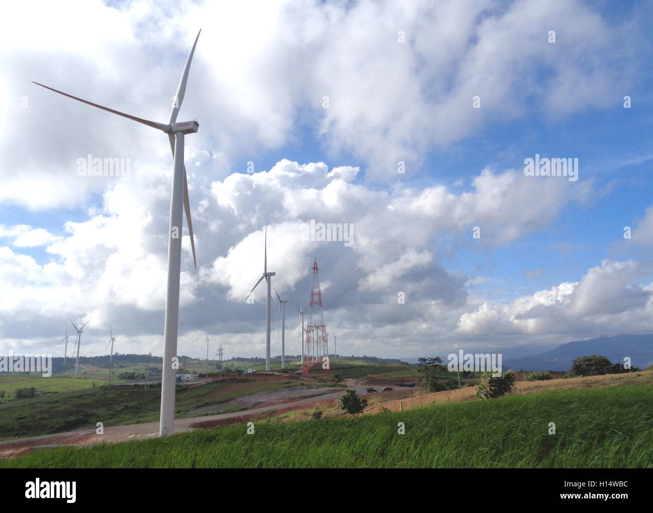 White Windmills against the Cloudy Sky Stock Photo - Alamy