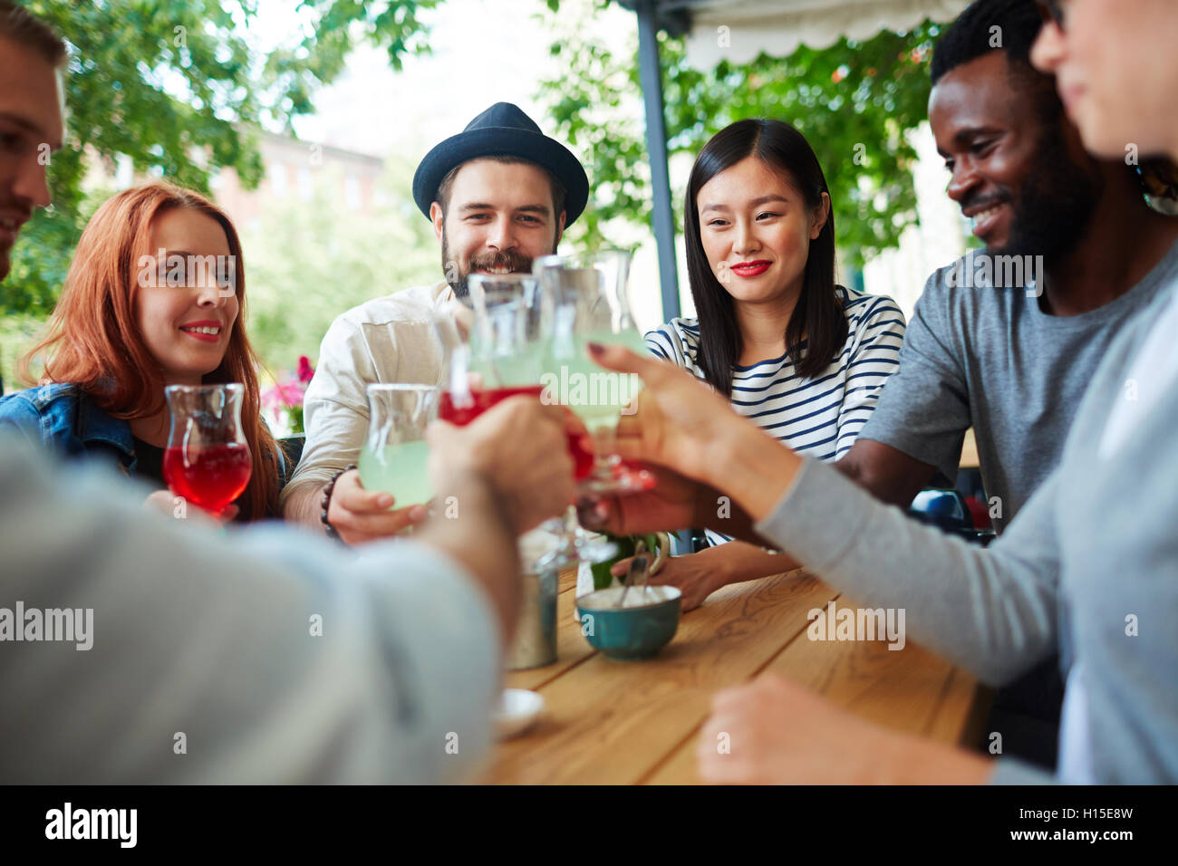 Toasting with drinks Stock Photo - Alamy