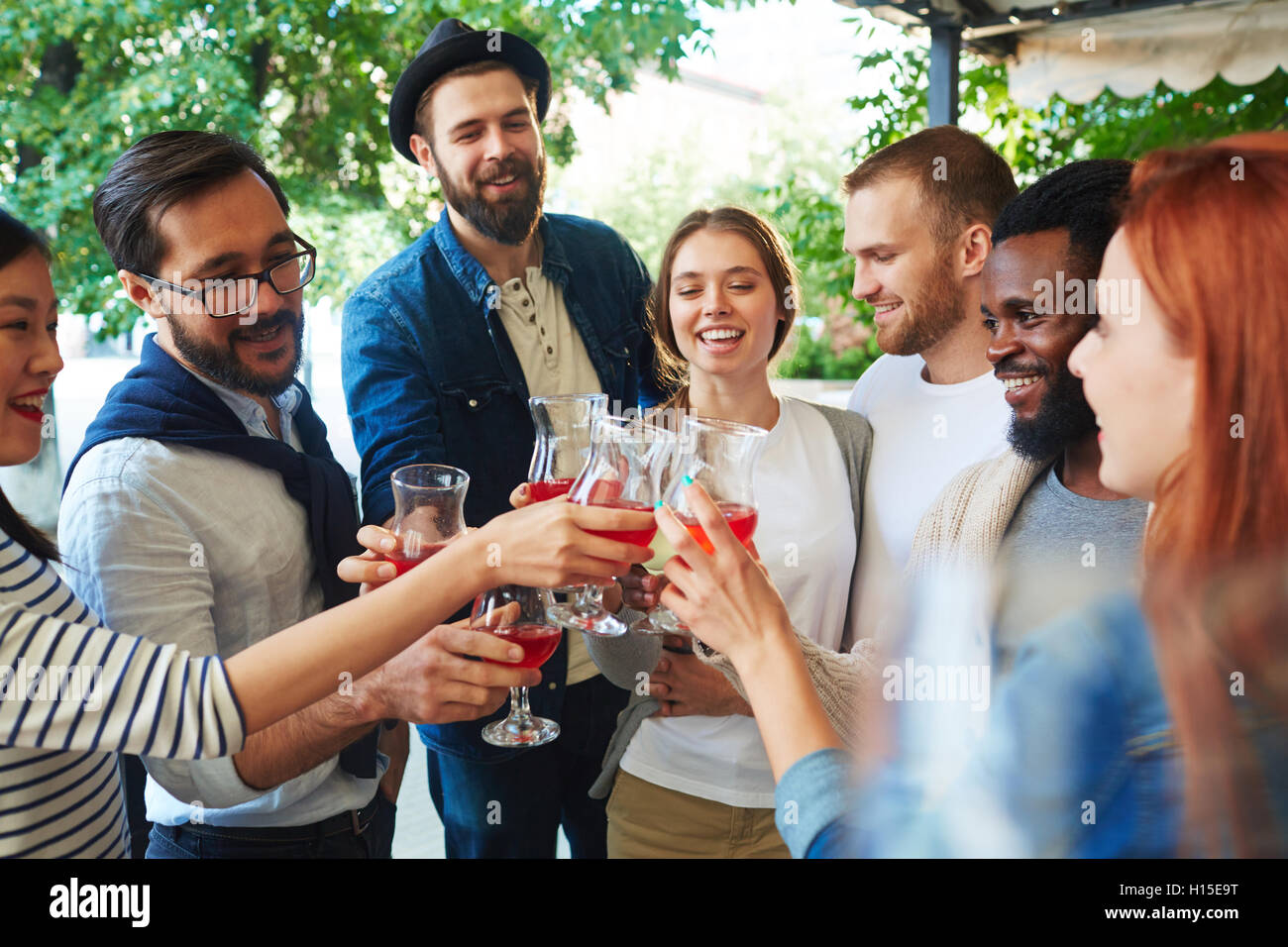 Toasting at hangout Stock Photo - Alamy