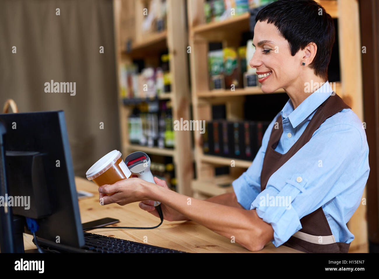 Cashier at work Stock Photo - Alamy