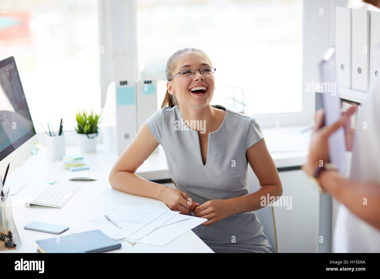 Laughing at joke Stock Photo - Alamy