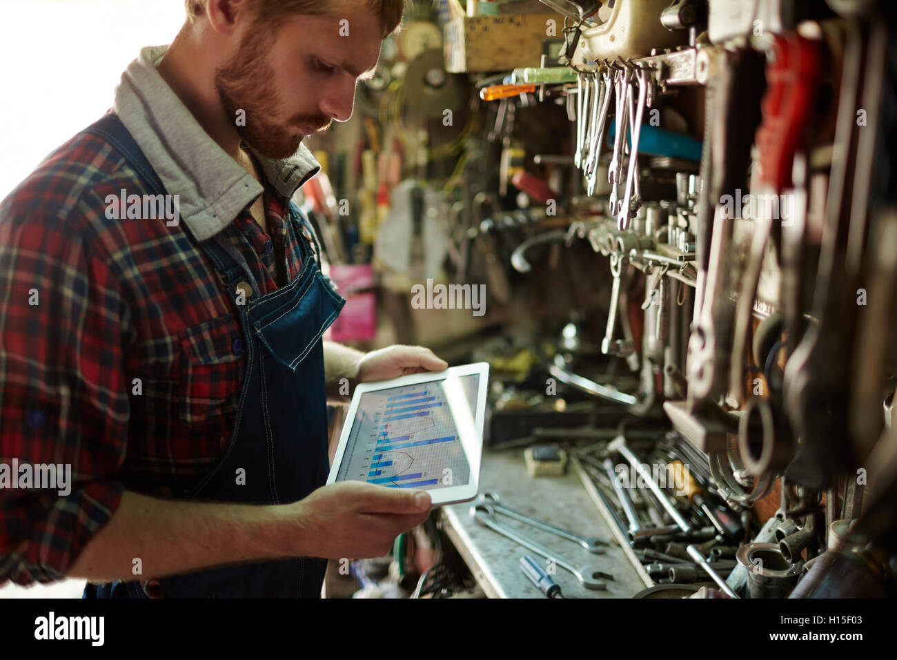 Repairman with touchpad Stock Photo - Alamy