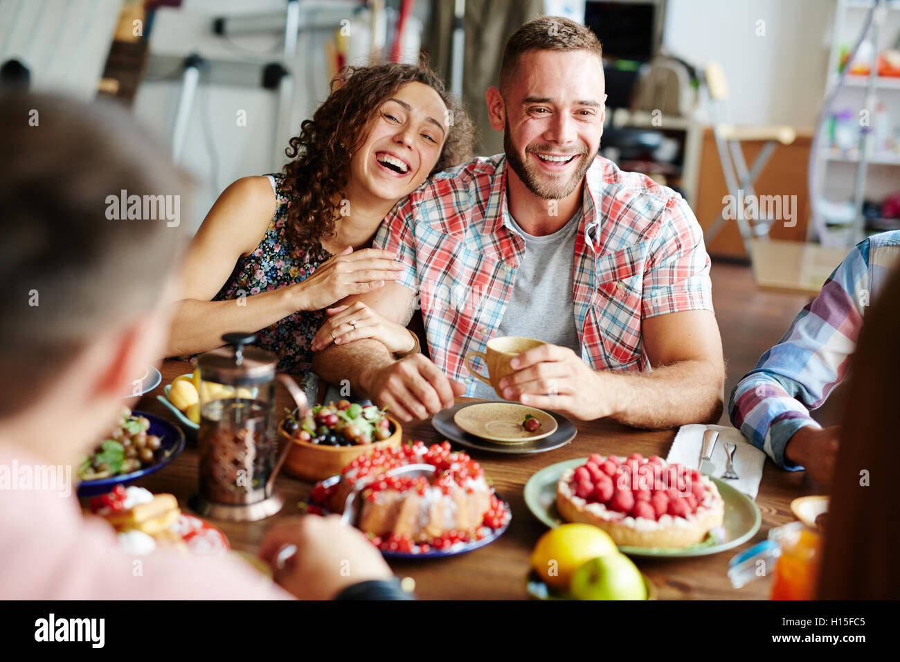 Laughing by dinner Stock Photo - Alamy