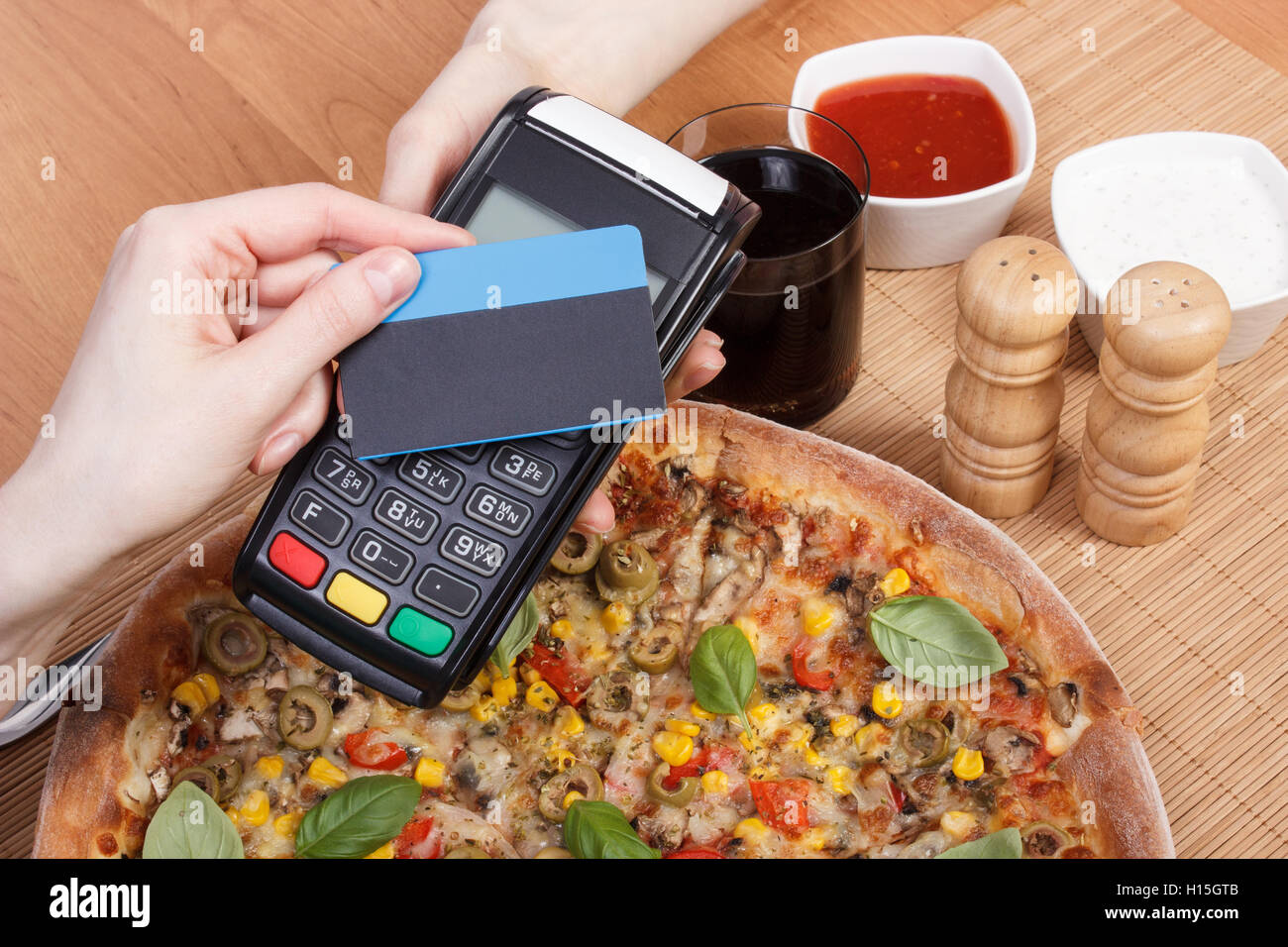 Using payment terminal with contactless credit card, cashless paying ...