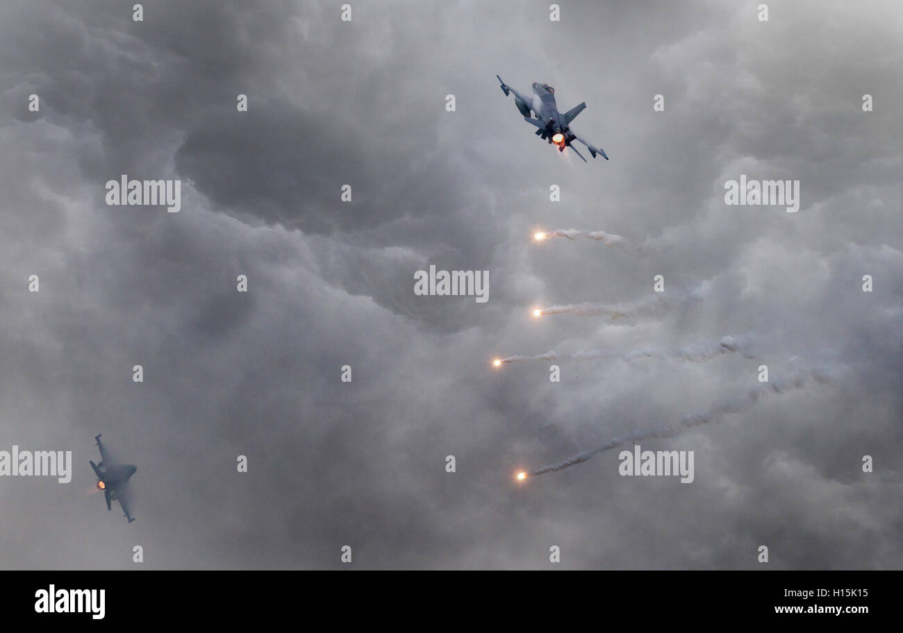 Fighter jets flying fast in the middle of a storm Stock Photo - Alamy