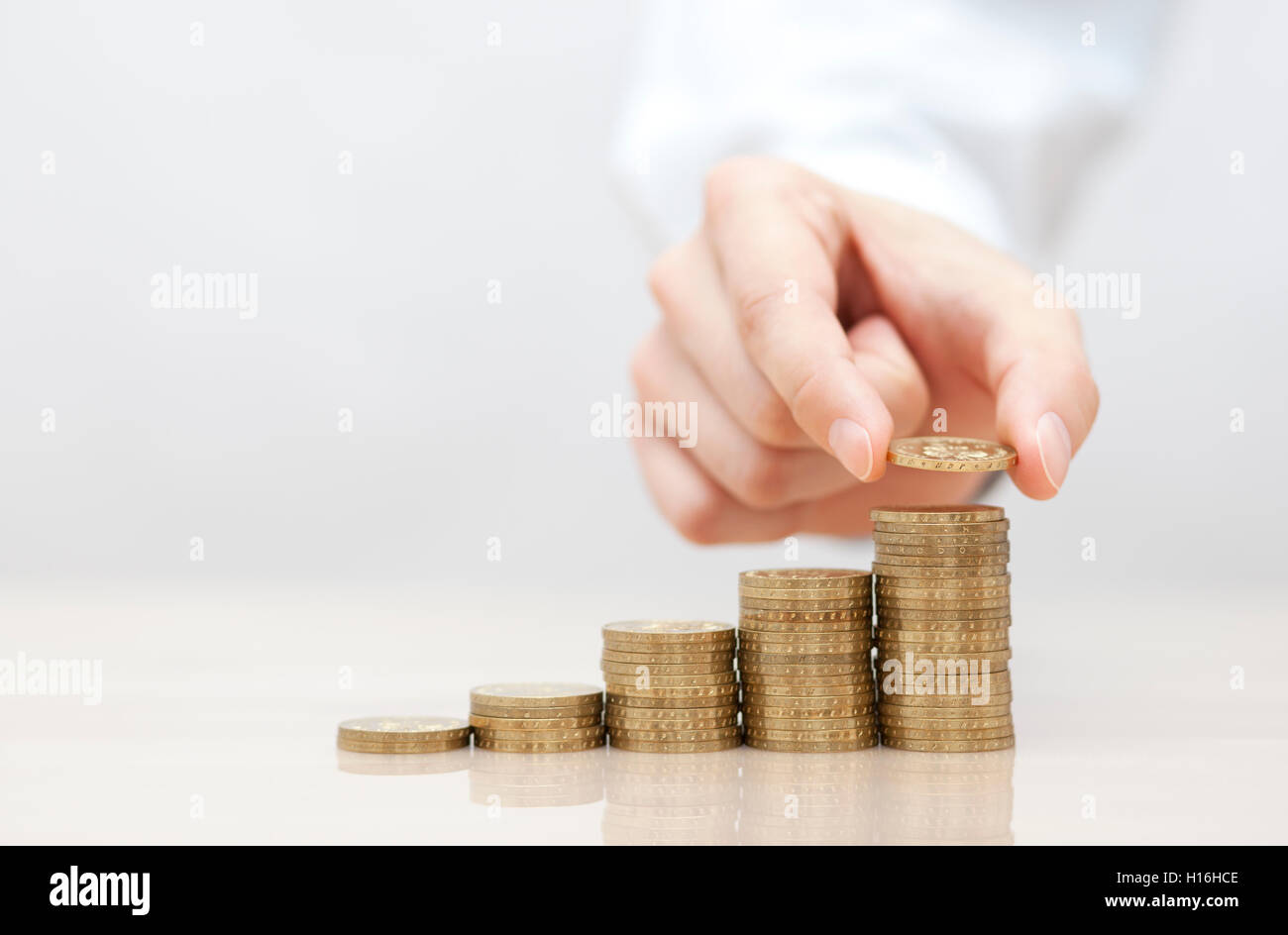 Rising stack of coins Stock Photo - Alamy