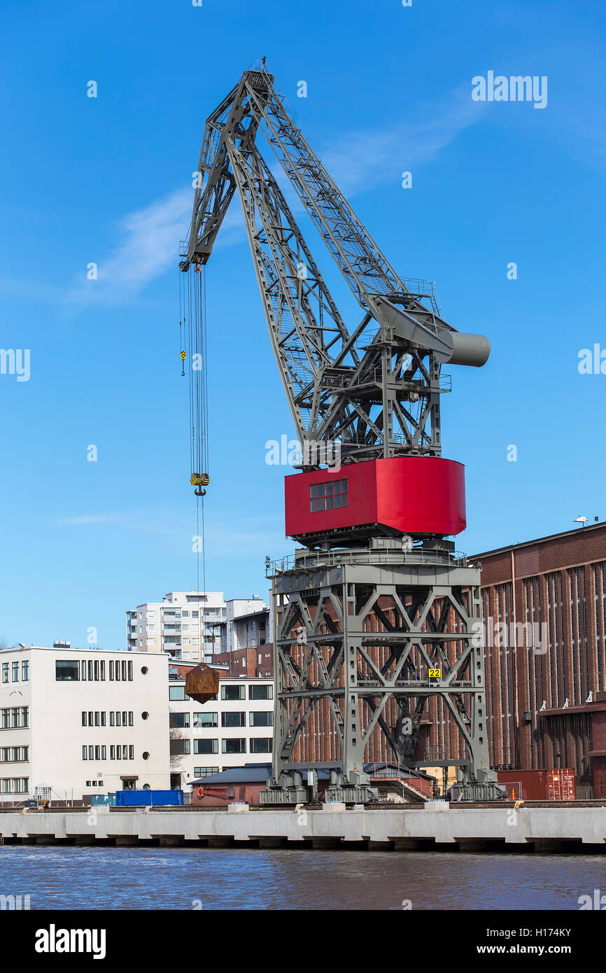 Dockside crane for loading bulk cargo on the quay of the river Stock ...