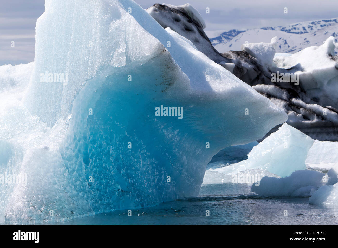 water moulded blue ice iceberg at Jokulsarlon glacial lagoon Iceland ...