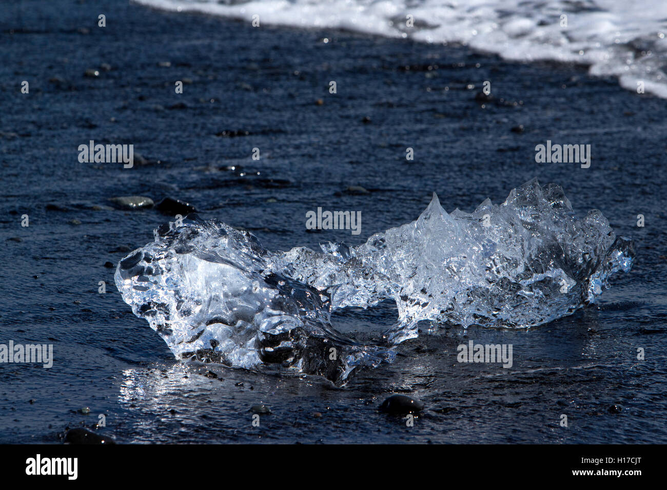 Ice washed up on black sand beach at jokulsarlon iceland Stock Photo ...