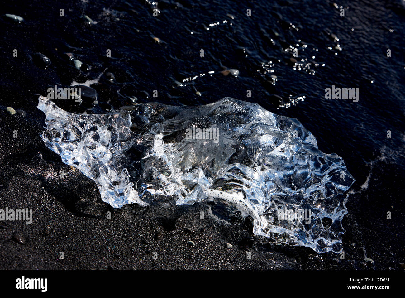 Ice washed up on black sand beach at jokulsarlon iceland Stock Photo ...