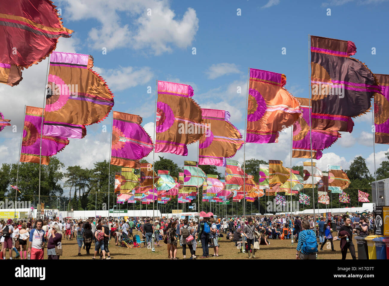 Womad festival arena flags, tents and sky Stock Photo - Alamy