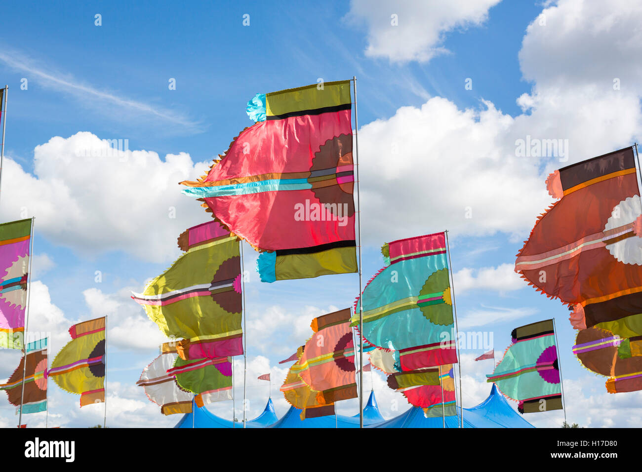 Womad festival arena flags, tents and sky Stock Photo - Alamy