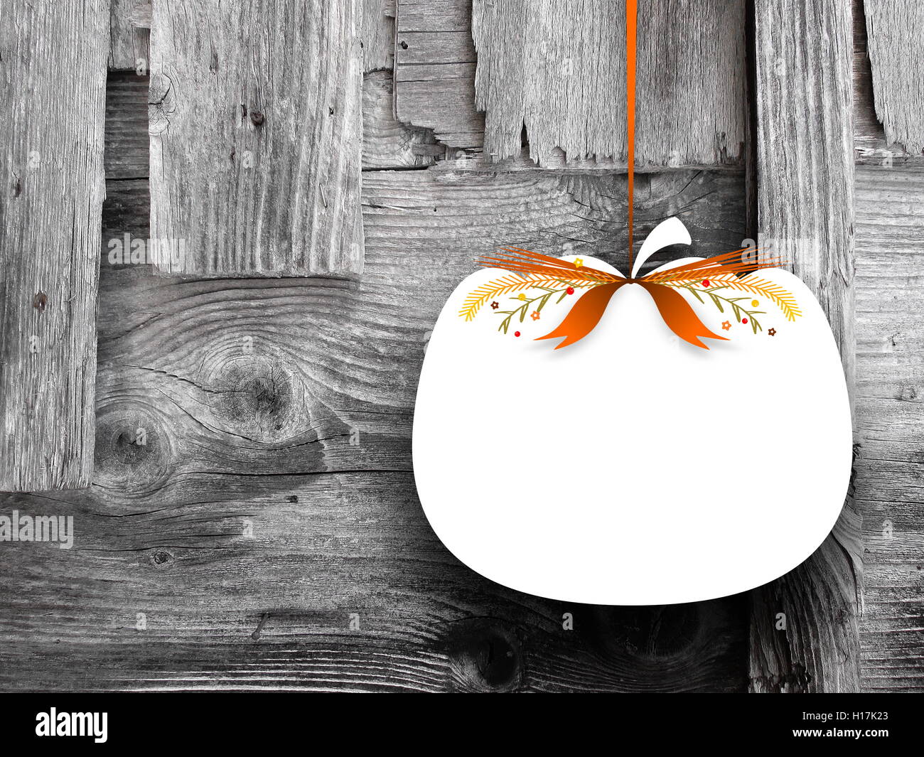 Close-up of one blank pumpkin shaped frame hanged by brown ribbon on ...