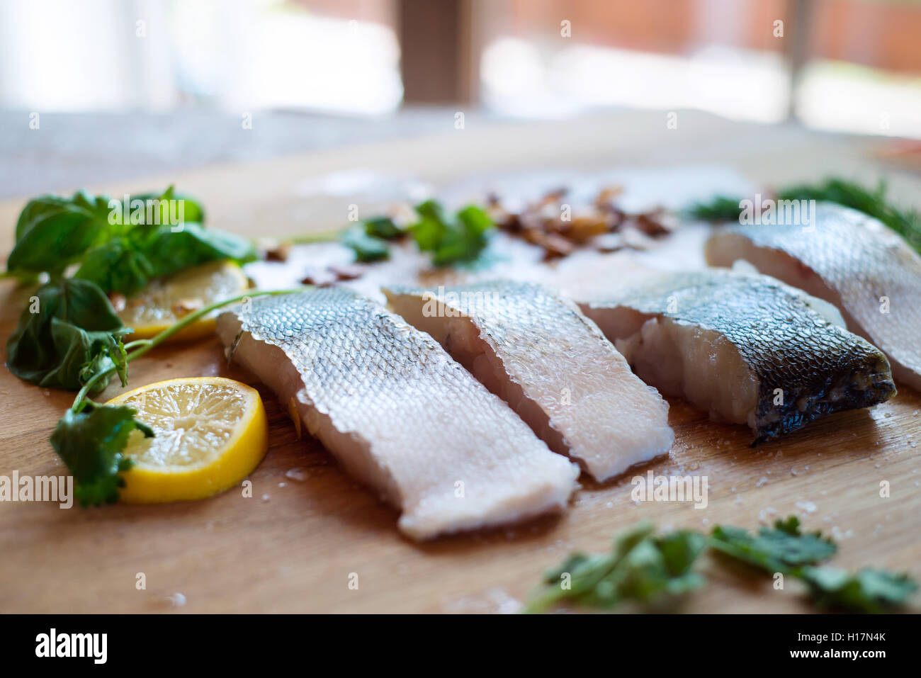 Raw zander fish fillets with lemon slices and herbs Stock Photo - Alamy