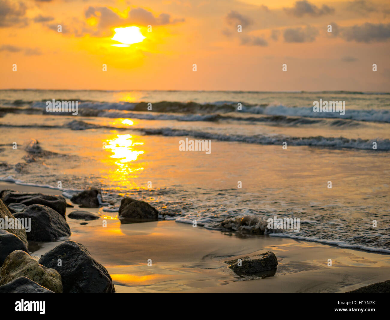 Tropical sunset on the beach. Bali island. Indonesia Stock Photo - Alamy