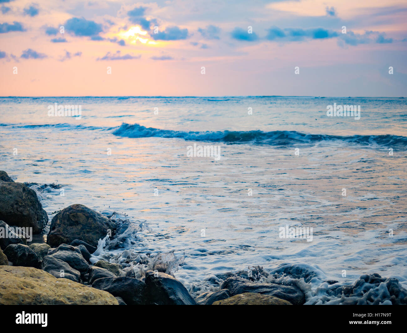 Tropical sunset on the beach. Bali island. Indonesia Stock Photo - Alamy