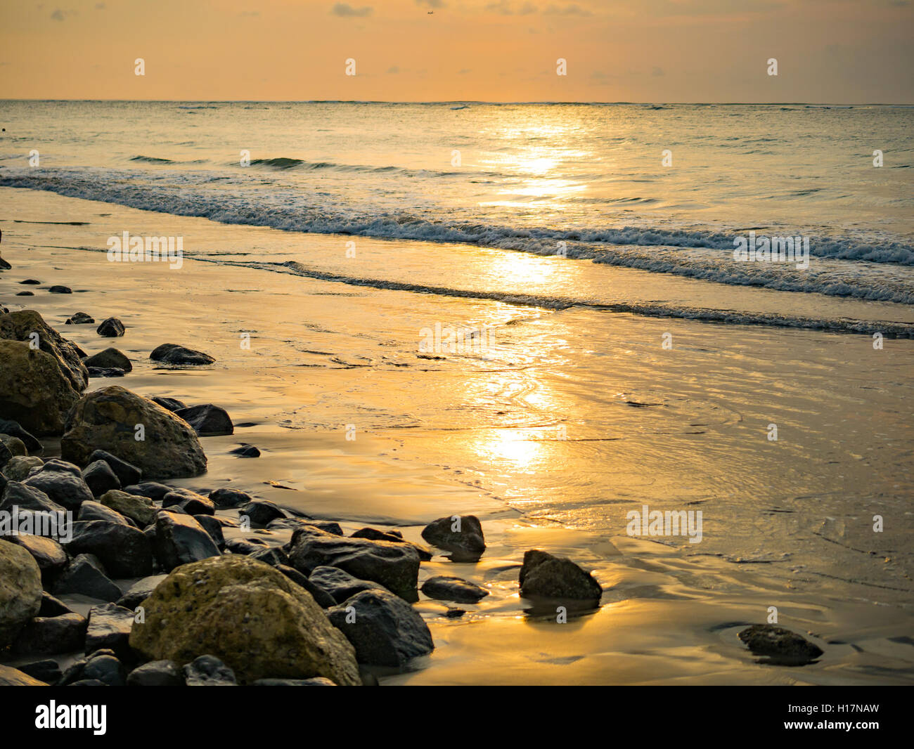 Tropical sunset on the beach. Bali island. Indonesia Stock Photo - Alamy