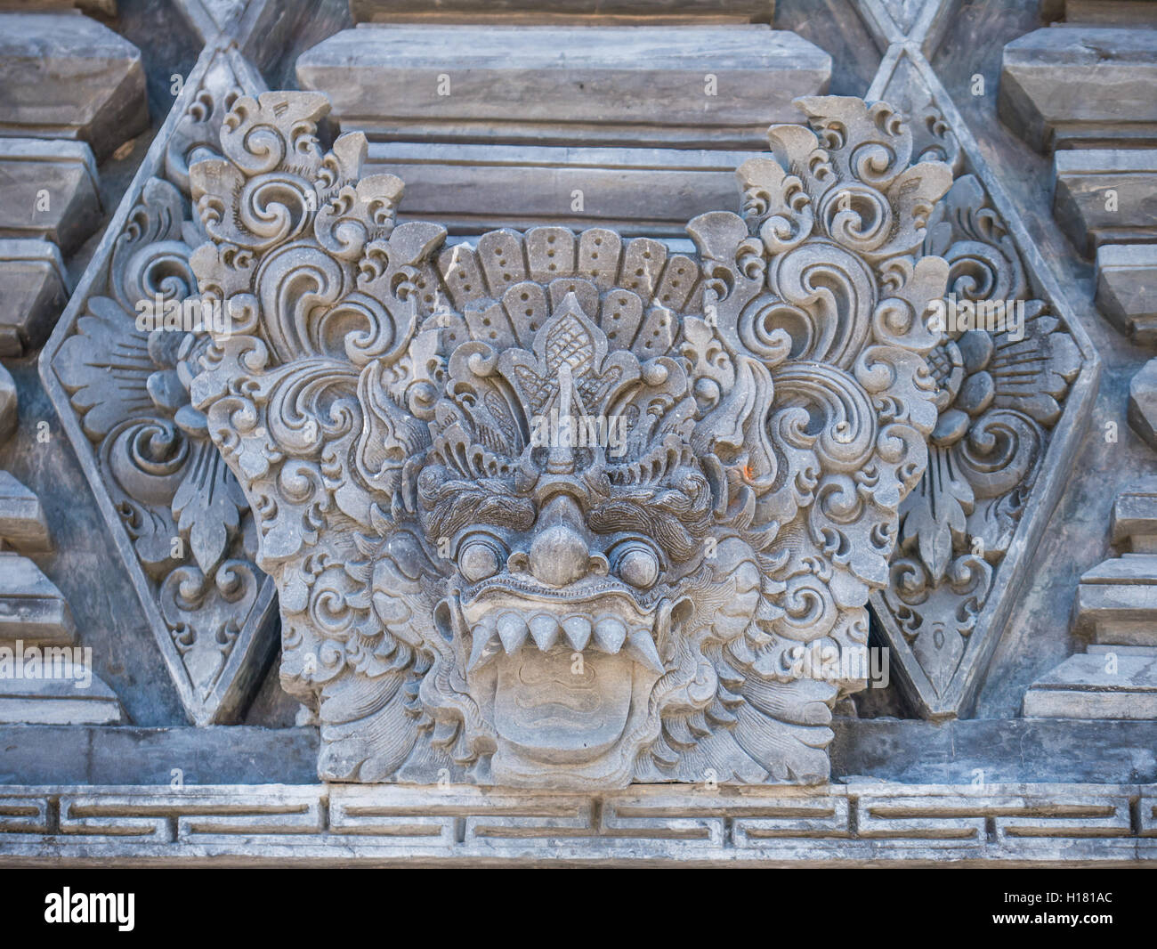 Stone sculpture on entrance door of Pura Padmasana Puja Mandala temple ...