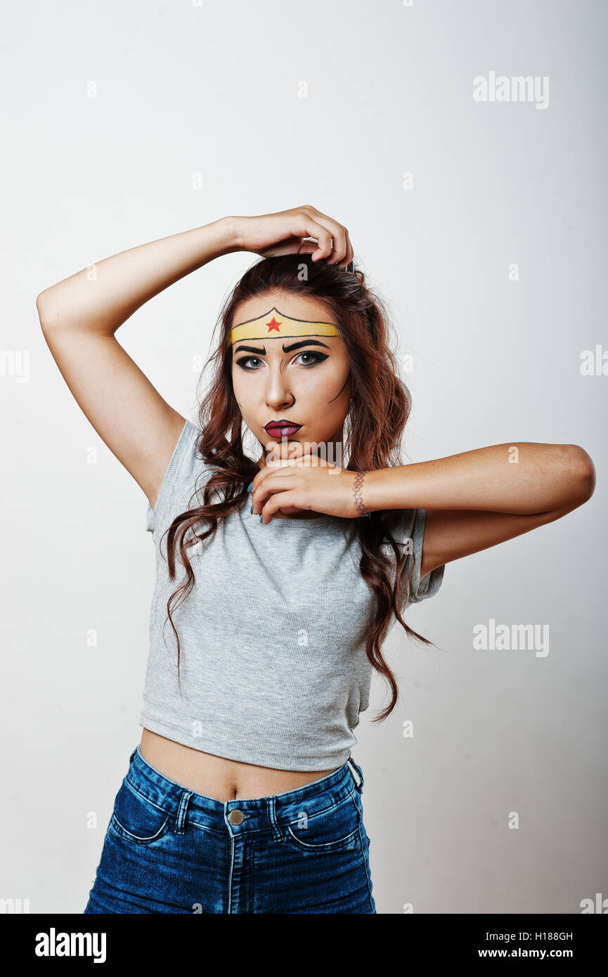 Studio portrait of girl with asian appearance and bright make up with ...