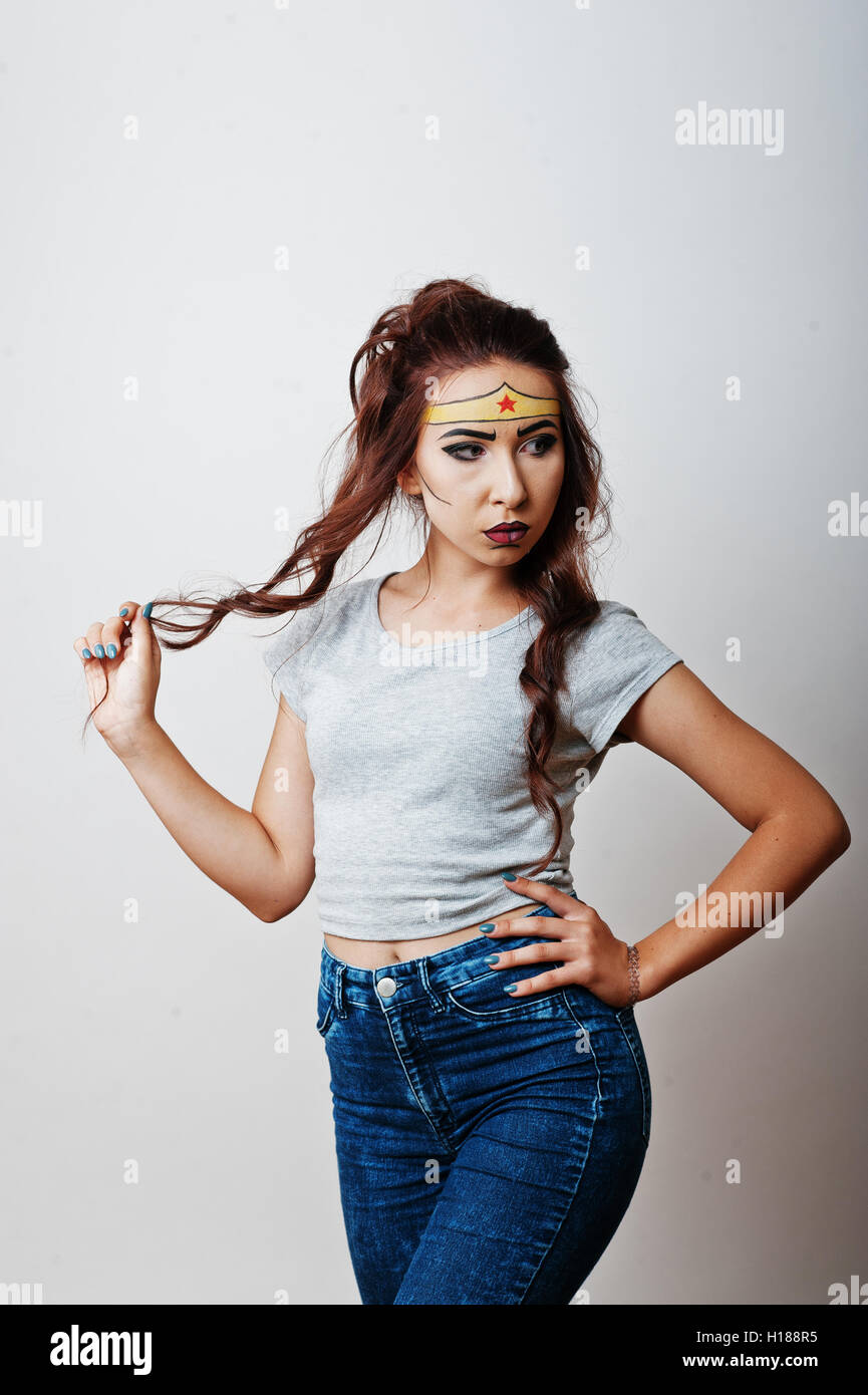 Studio portrait of girl with asian appearance and bright make up with ...