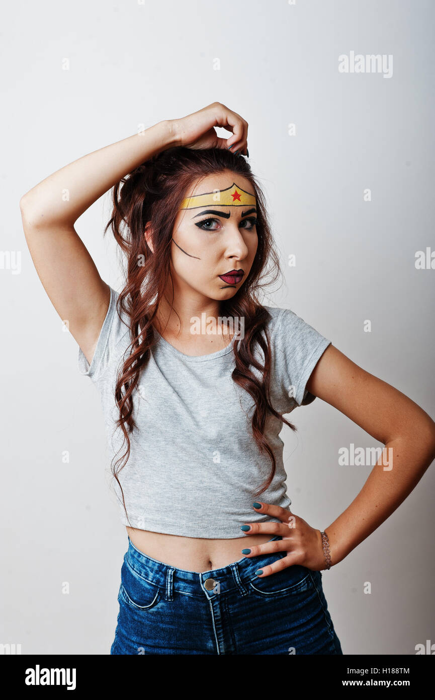 Studio portrait of girl with asian appearance and bright make up with ...