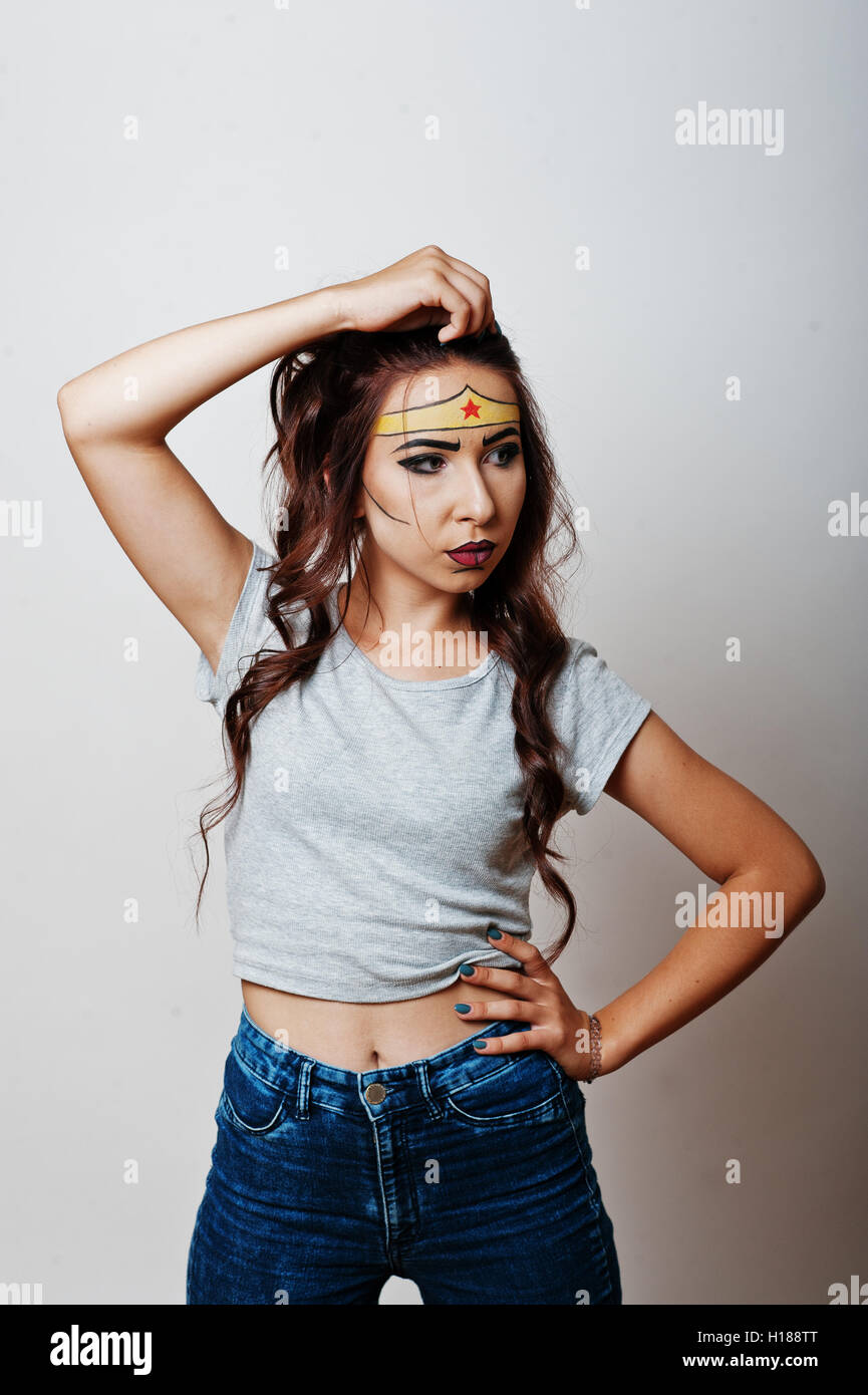 Studio portrait of girl with asian appearance and bright make up with ...