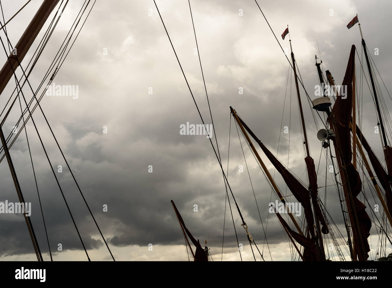 Yacht masts and rigging set against a rain filled sky Stock Photo - Alamy