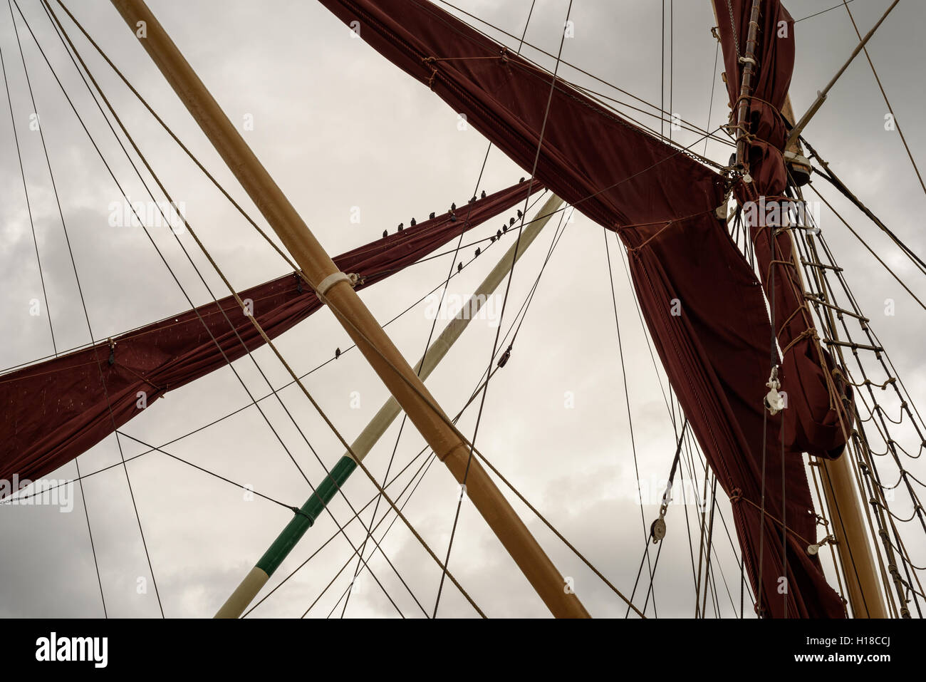 Yacht masts and rigging set against a rain filled sky Stock Photo - Alamy