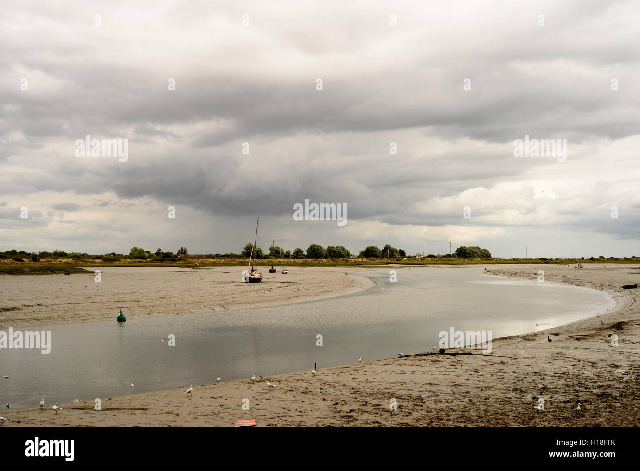 Moored boats and yachts at low tide on Maldon Estuary in Essex England ...