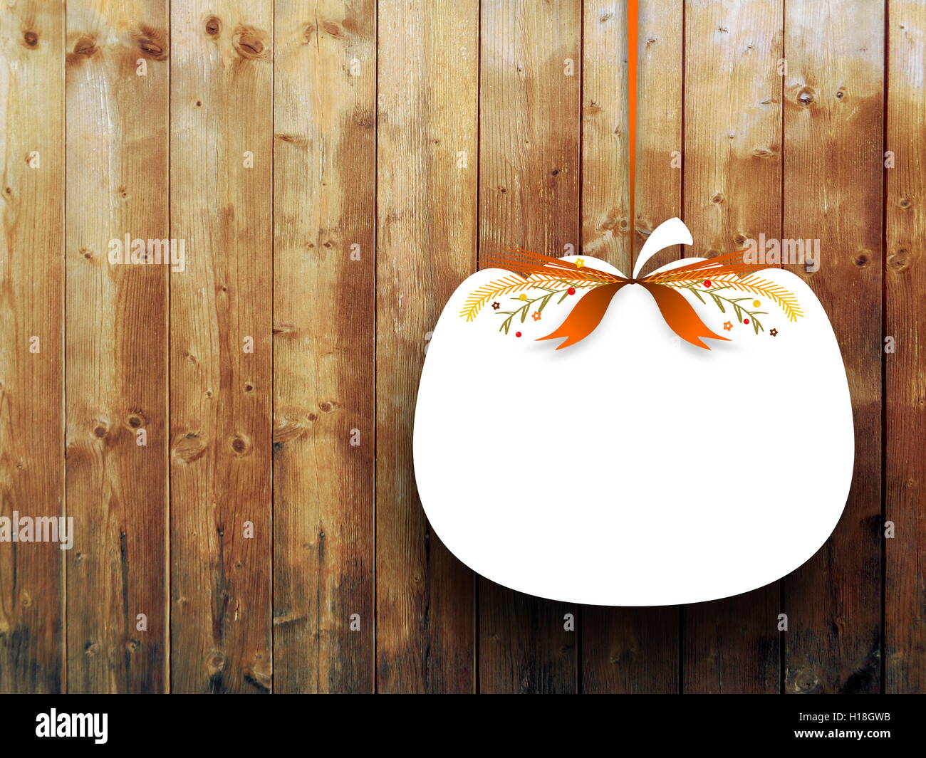 Close-up of one blank pumpkin shaped frame hanged by brown ribbon on ...