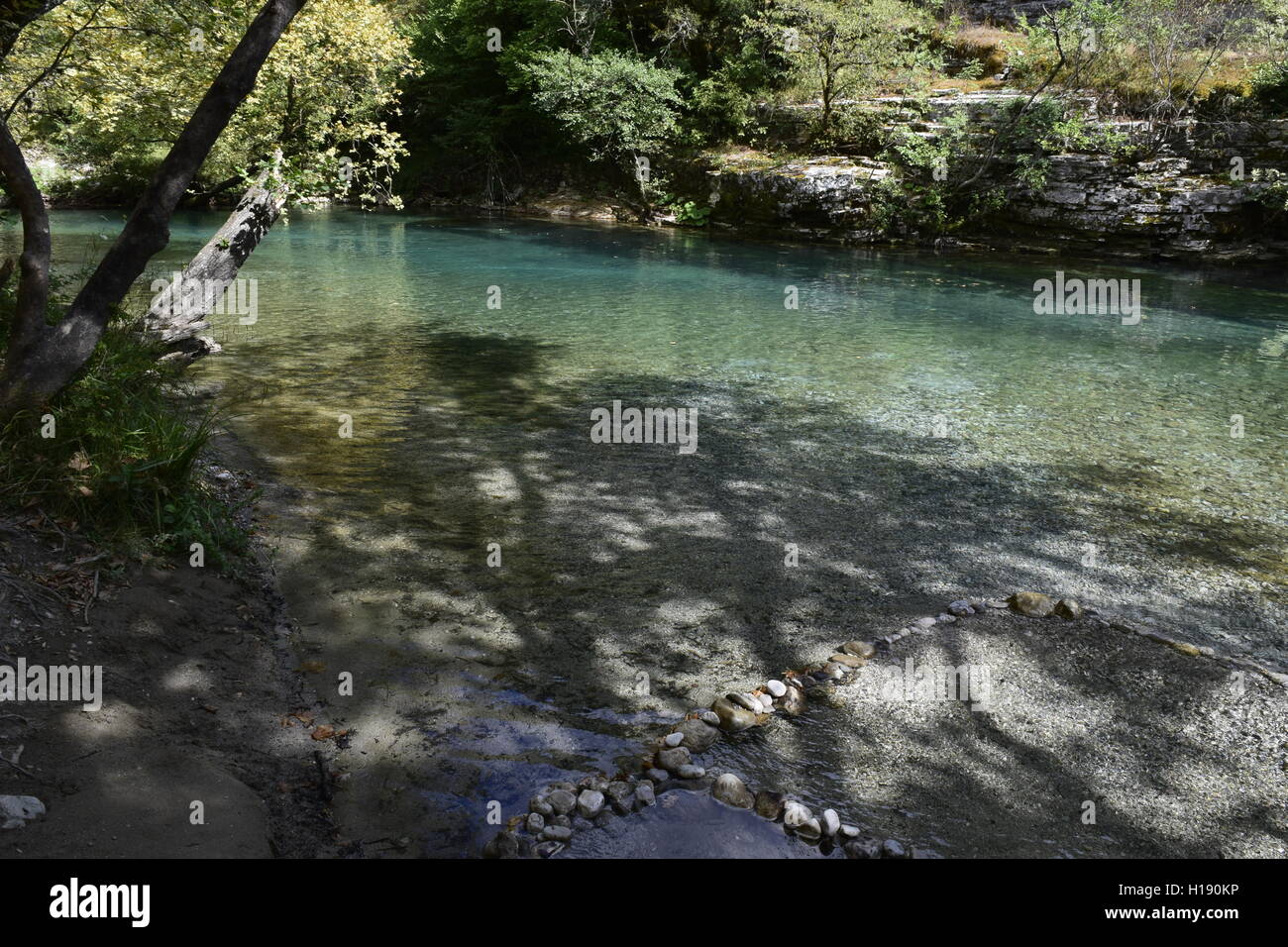 a crystal clear river of Greece Stock Photo - Alamy