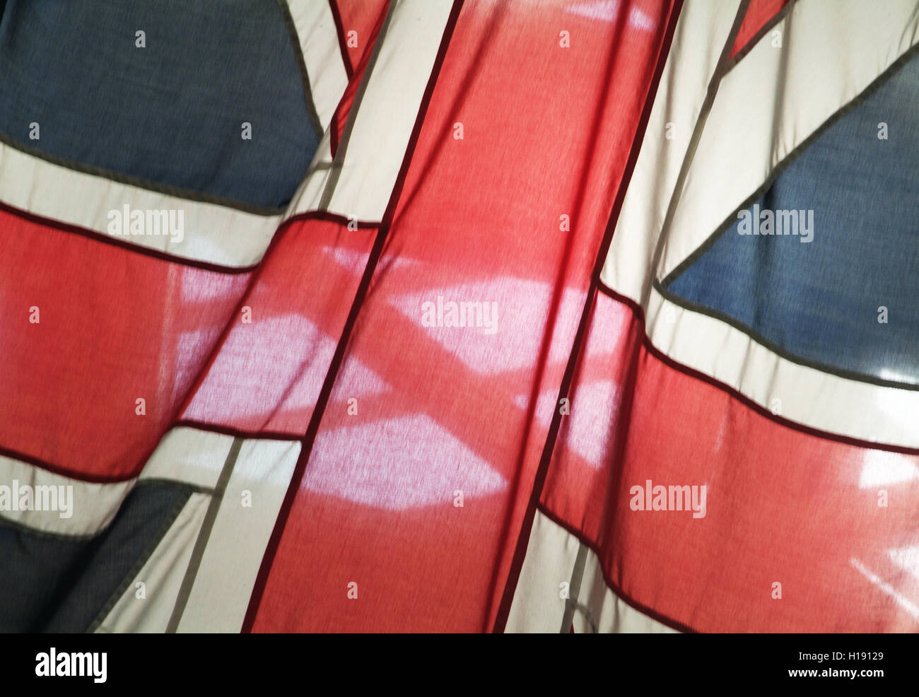 semi-transparent Union Jack flag photographed in a London market Stock ...