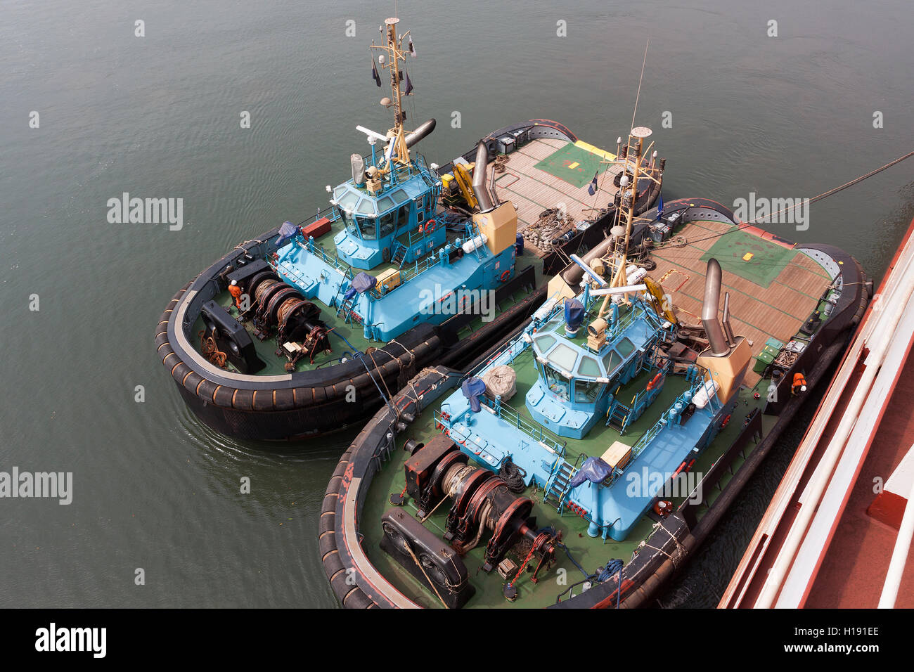 Marine and port operations from jetty.Two tugs tied up and waiting for ...