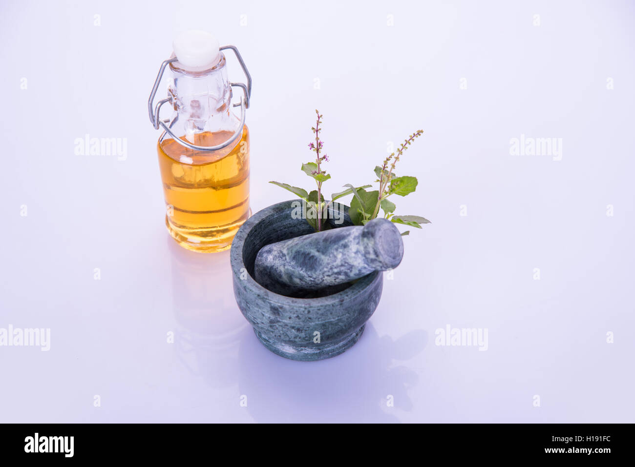 Tulsi oil or holy basil oil with Mortar and Pestle, tulsi or holy basil ...